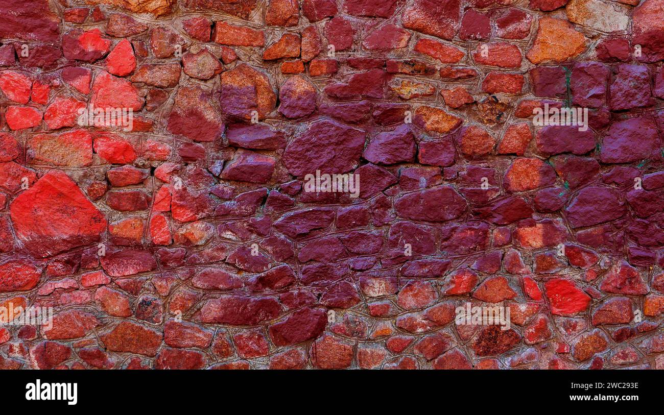 Abstract background of a multi-colored stone wall Stock Photo - Alamy