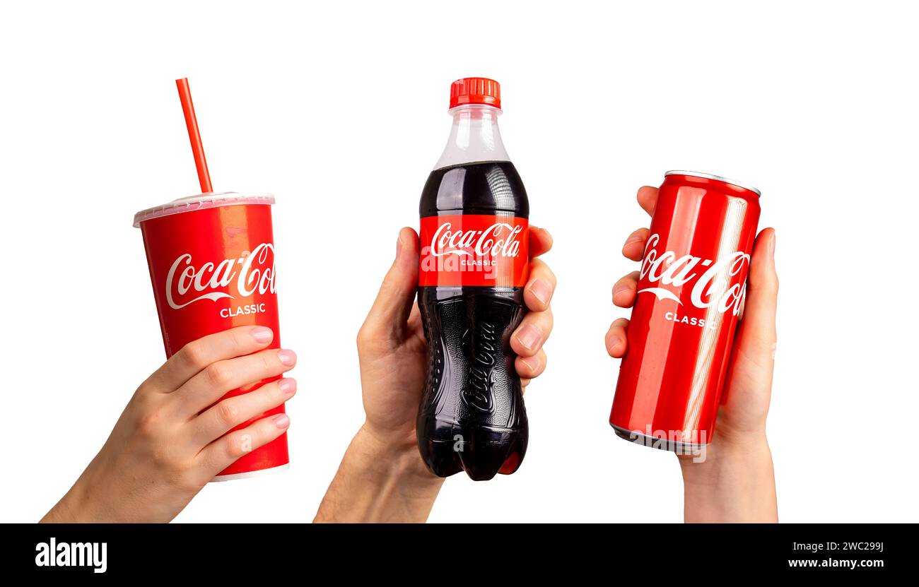 Lodz, Poland May 26 2023 Hands holding Coca Cola drink in different ...