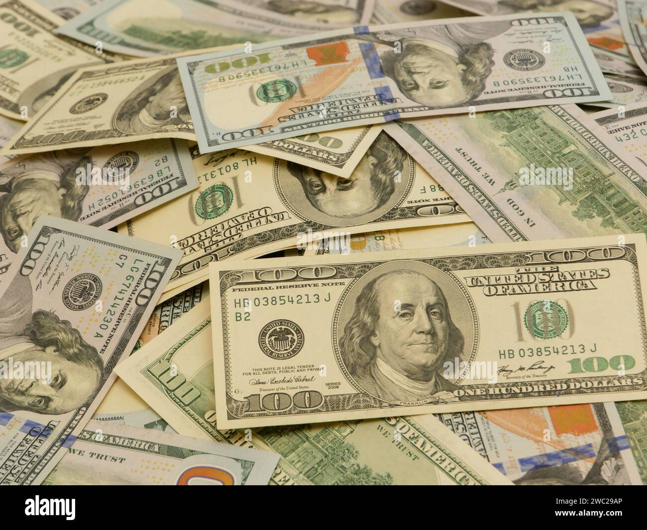 Flat texture and background of real $100 bills, numbers are different ...