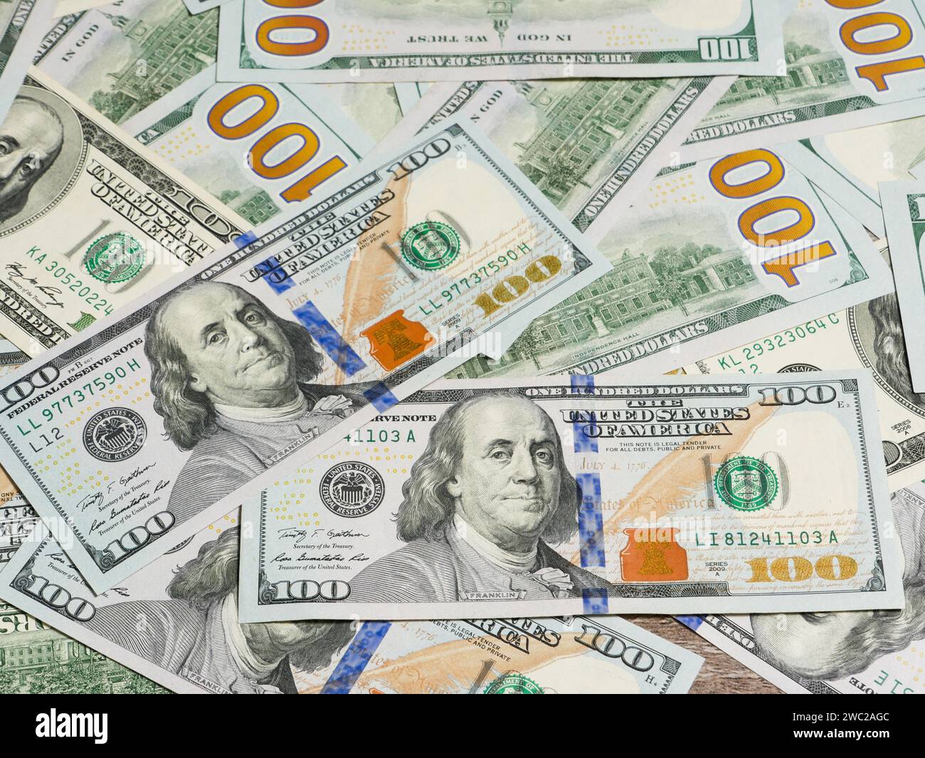 Group of money stack of 100 US dollars banknotes a lot of the ...