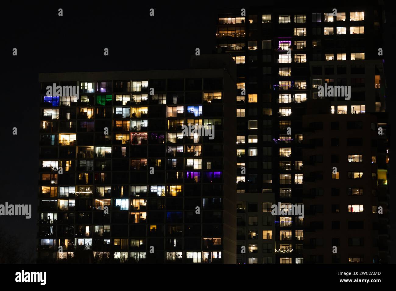 A city at night showing high rise apartment buildings and condo's Stock ...