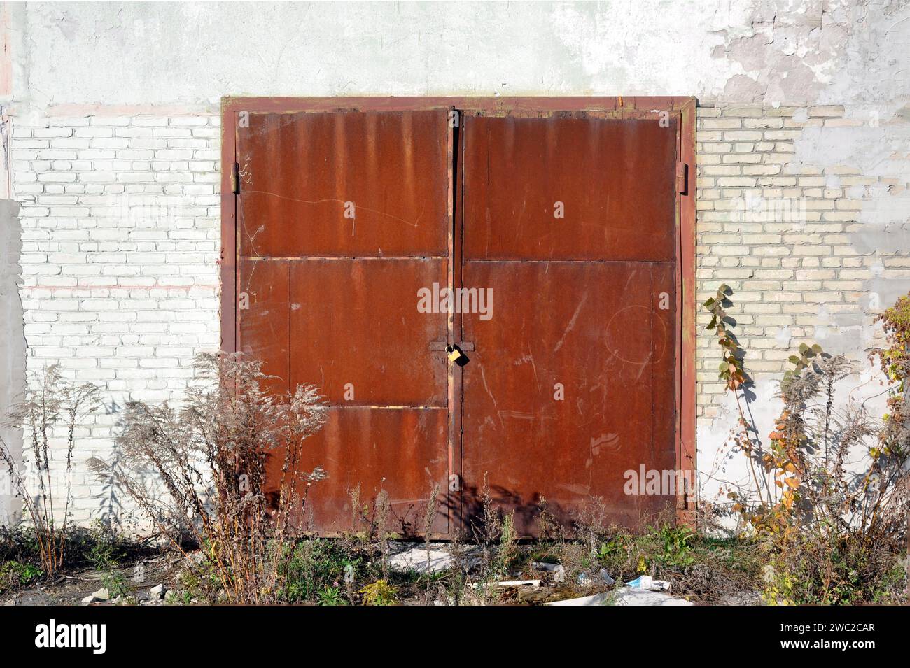 Old rusty metal gates in an abandoned industrial area Stock Photo - Alamy