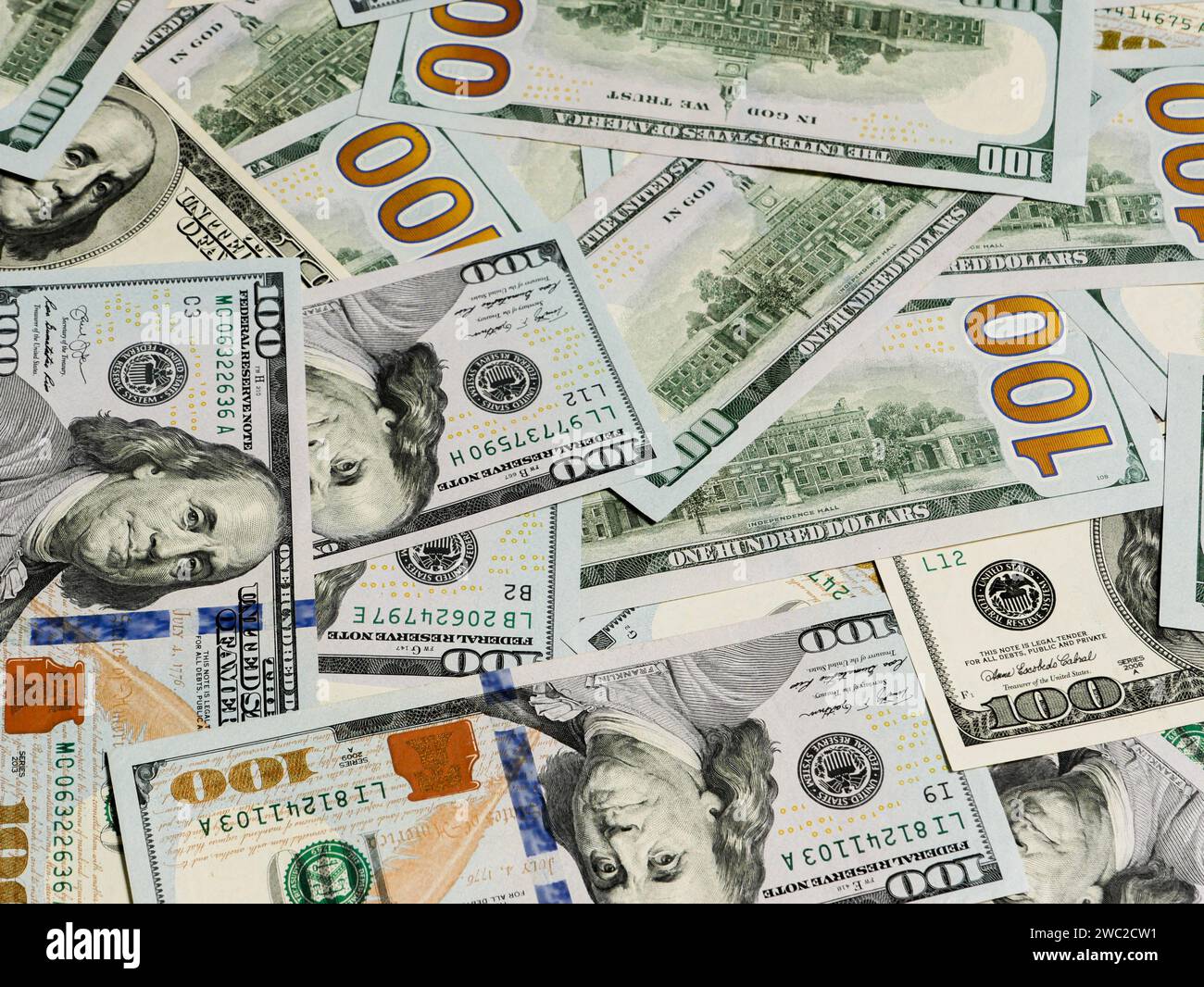 Group of money stack of 100 US dollars banknotes a lot of the ...
