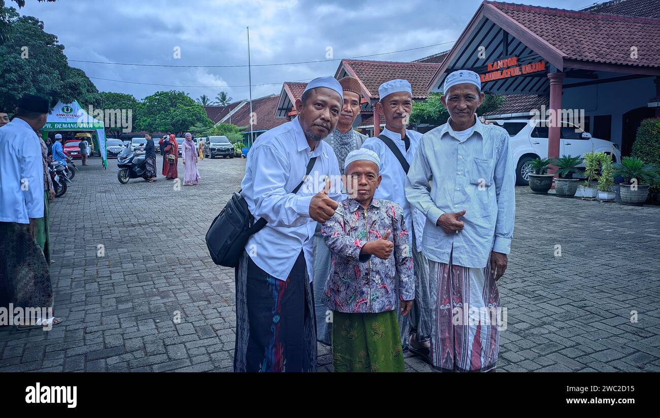 A group of men posing for a photo. Asia's Sunni Muslim community in ...