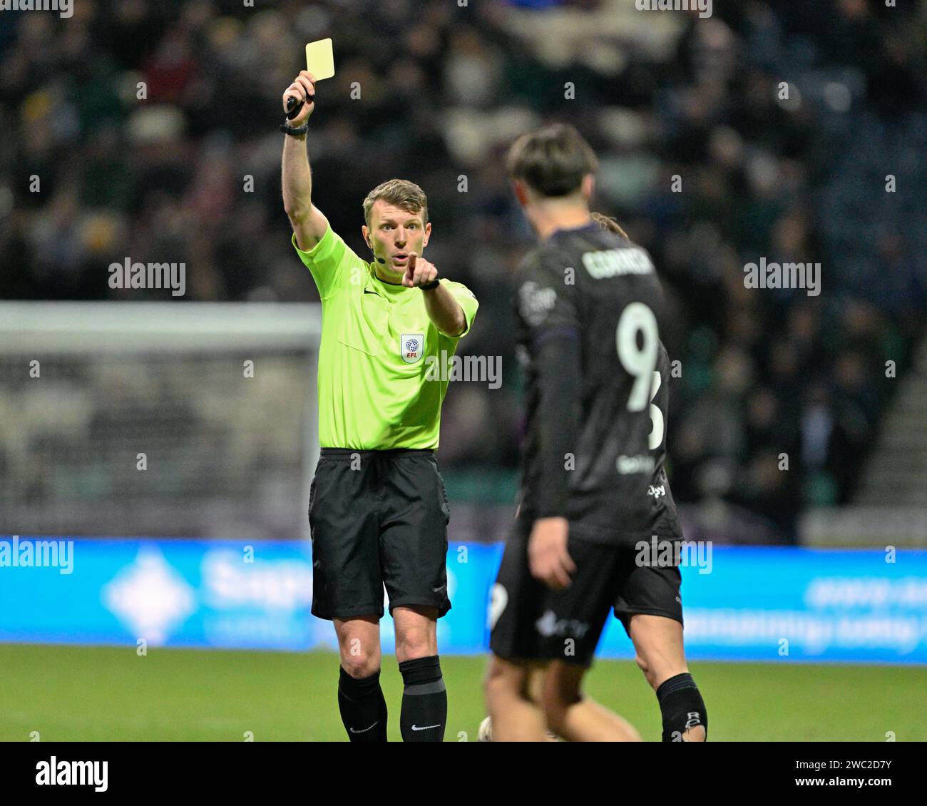 Preston, UK. 13th Jan, 2024. Referee Samuel Barrott shows Harry Cornick ...