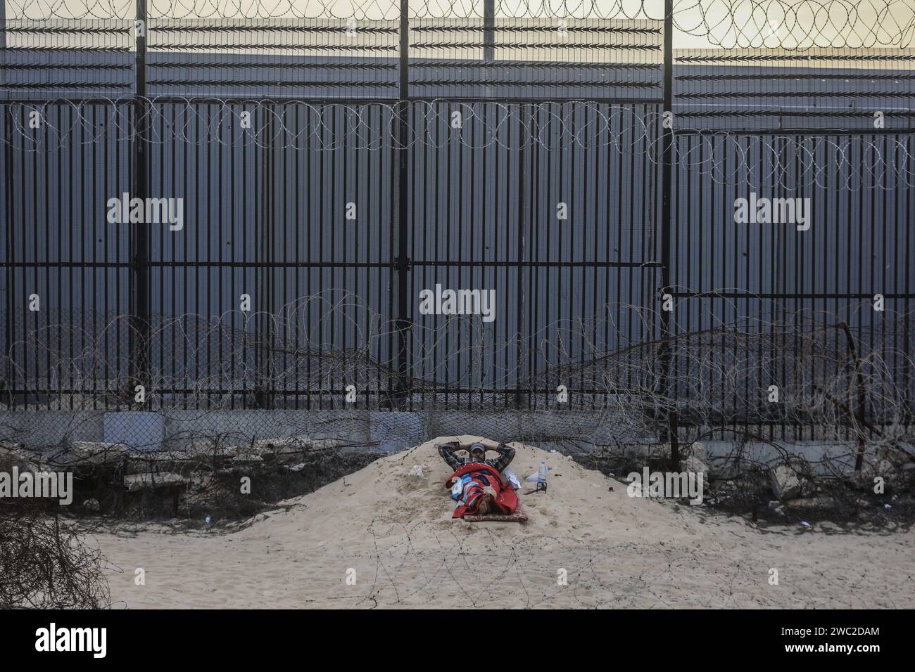 Rafah, Palestinian Territories. 13th Jan, 2024. A displaced Palestinian ...
