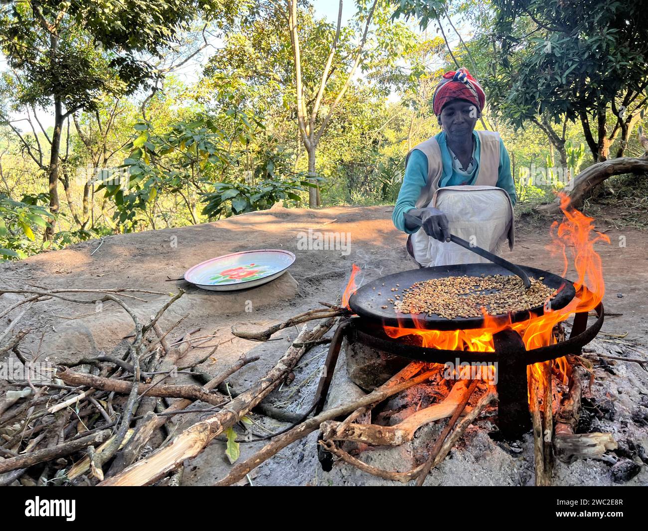 Yirga Alem, Ethiopia, Febuary 20th, 2023 ; woman cooking coffee to make ...
