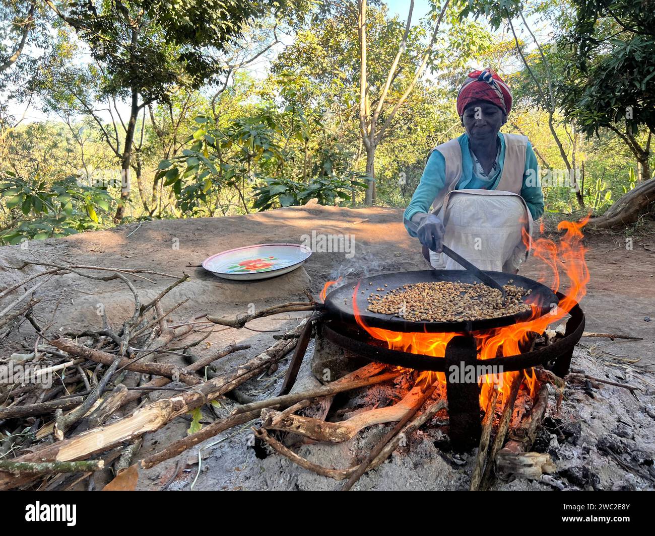 Yirga Alem, Ethiopia, Febuary 20th, 2023 ; woman cooking coffee to make ...