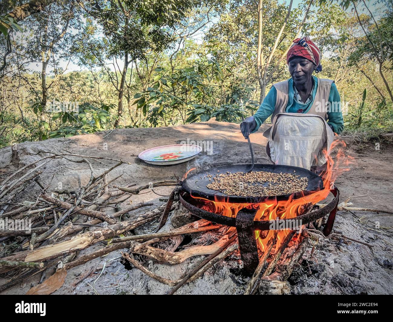Yirga Alem, Ethiopia, Febuary 20th, 2023 ; woman cooking coffee to make ...
