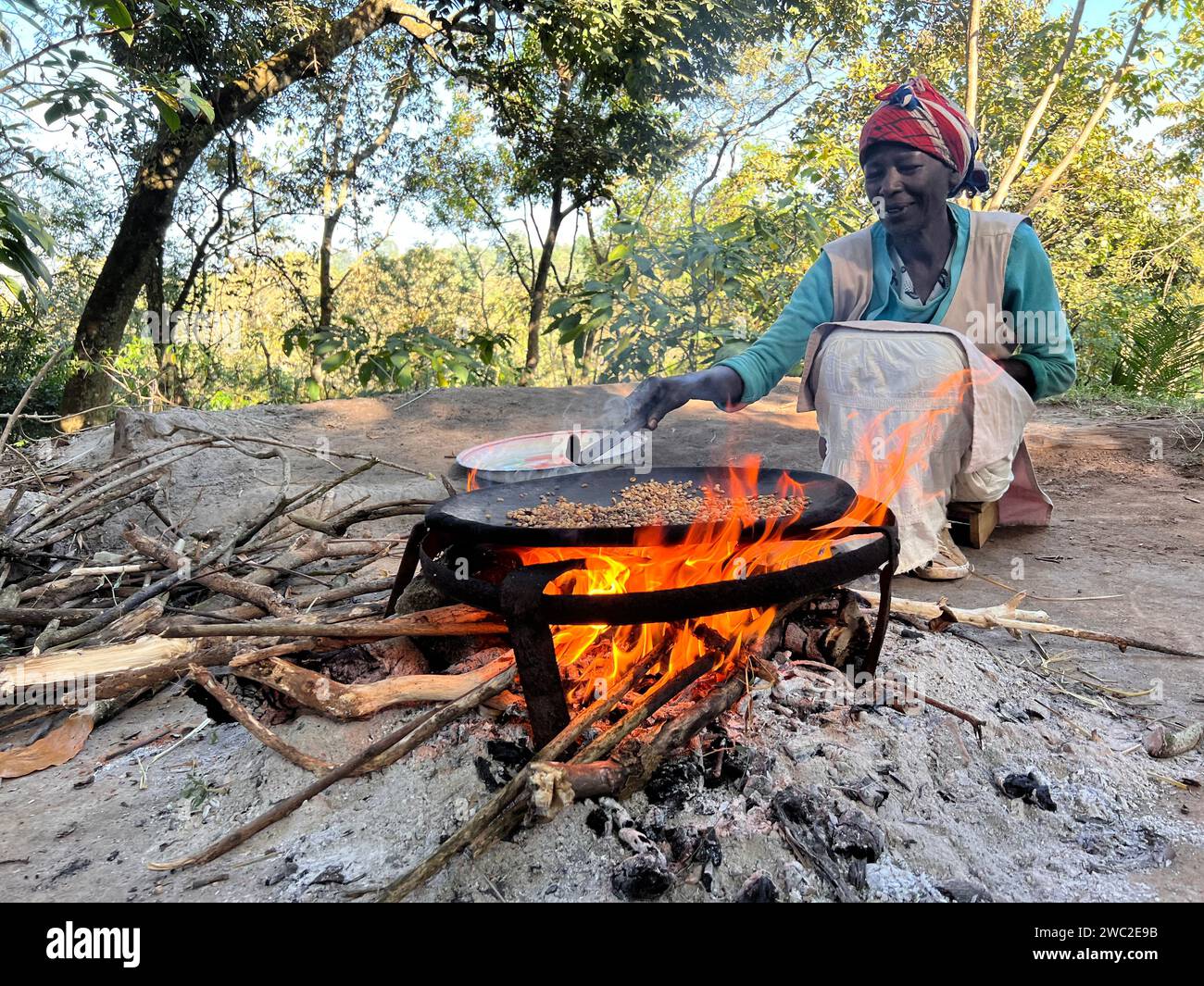 Yirga Alem, Ethiopia, Febuary 20th, 2023 ; woman cooking coffee to make ...
