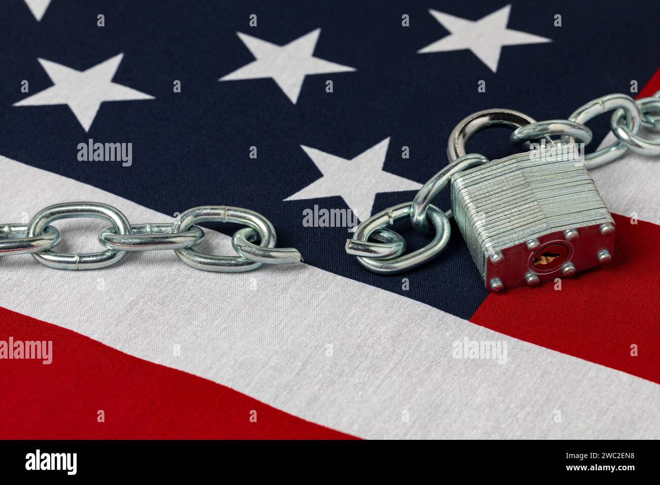 United States flag with lock and broken chain. Border security ...