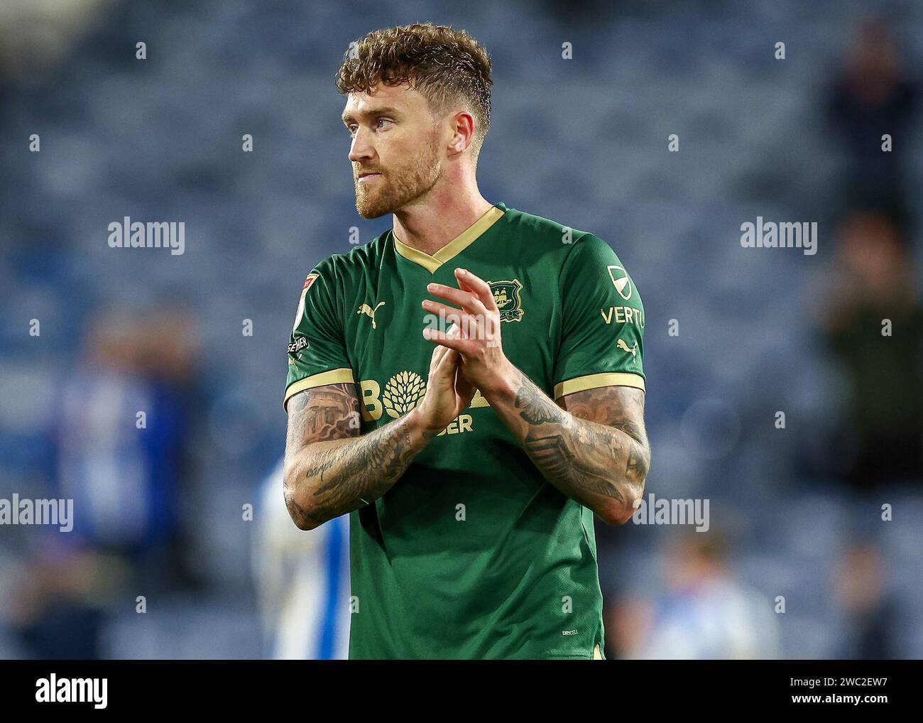 Dan Scarr of Plymouth Argyle applauds the fans at full time during the ...