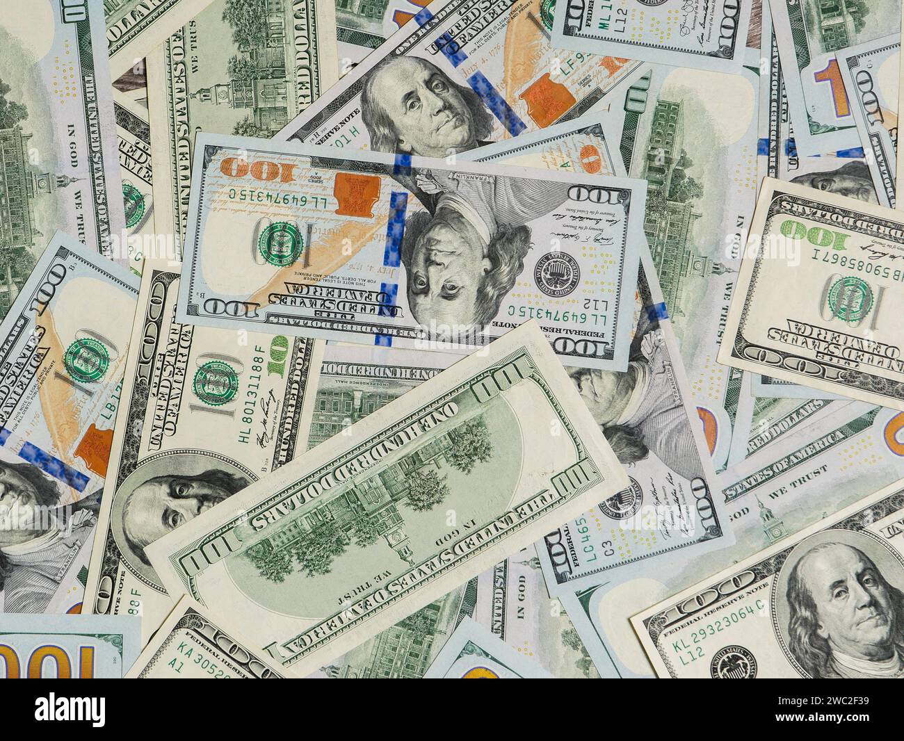 Flat texture and background of real 100 bills, numbers are different ...