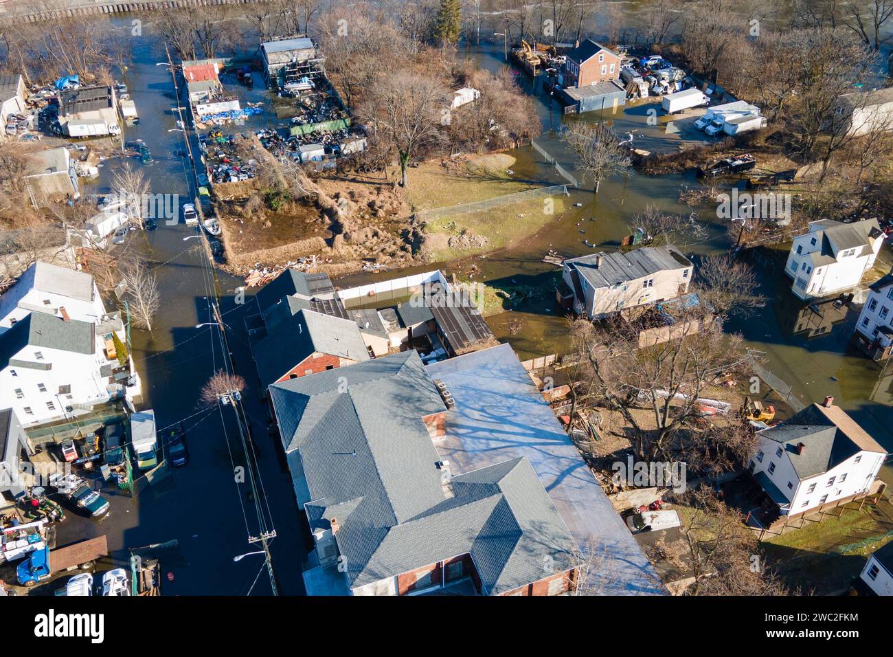 Water overflowing from the Passaic River after heavy rain floods a ...