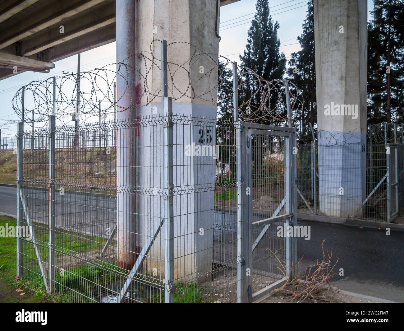 Bridge abutment fencing in the form of a fence with barbed wire Stock ...