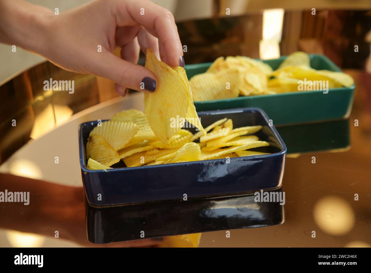 Young Sad Woman Having Unhealthy Snack Eating Potato Chips In The