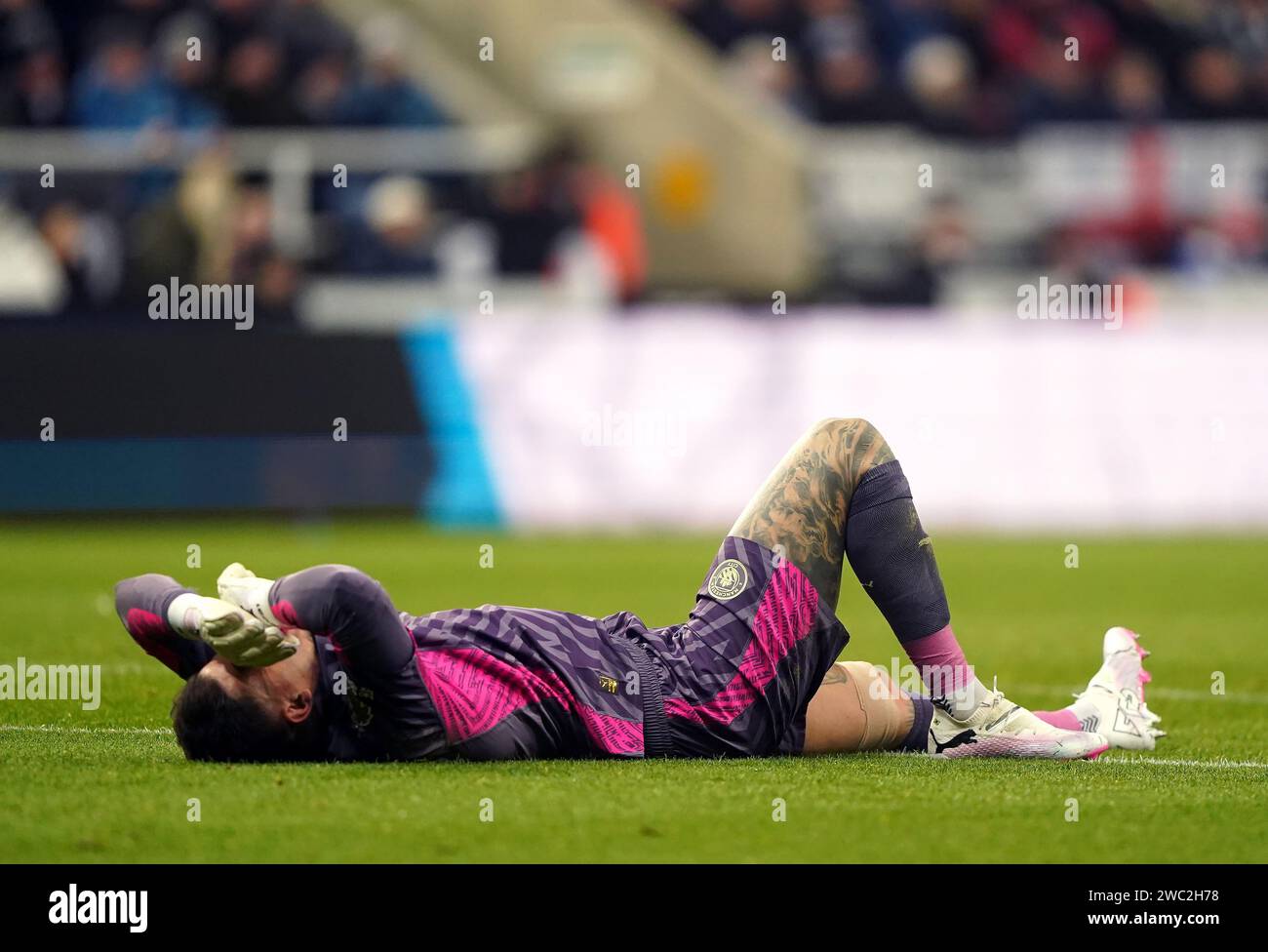 Manchester City goalkeeper Ederson reacts to an injury during the ...