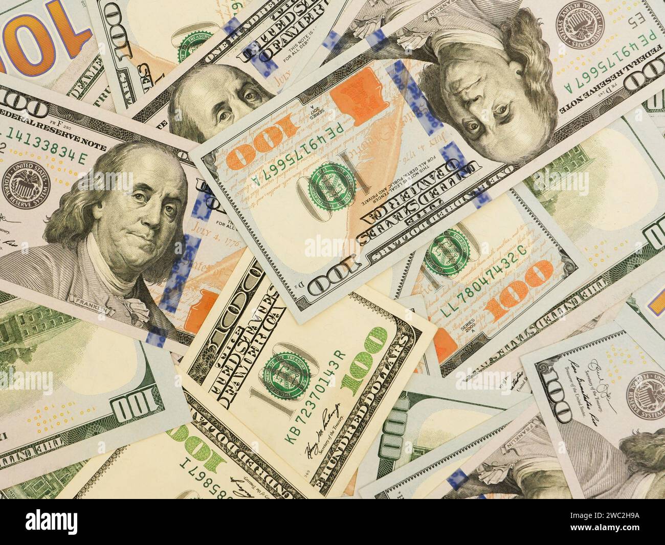 Flat texture and background of real $100 bills, numbers are different ...