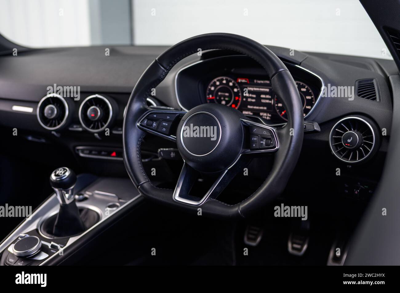 A close-up shot of the dashboard and steering wheel of a car Stock ...