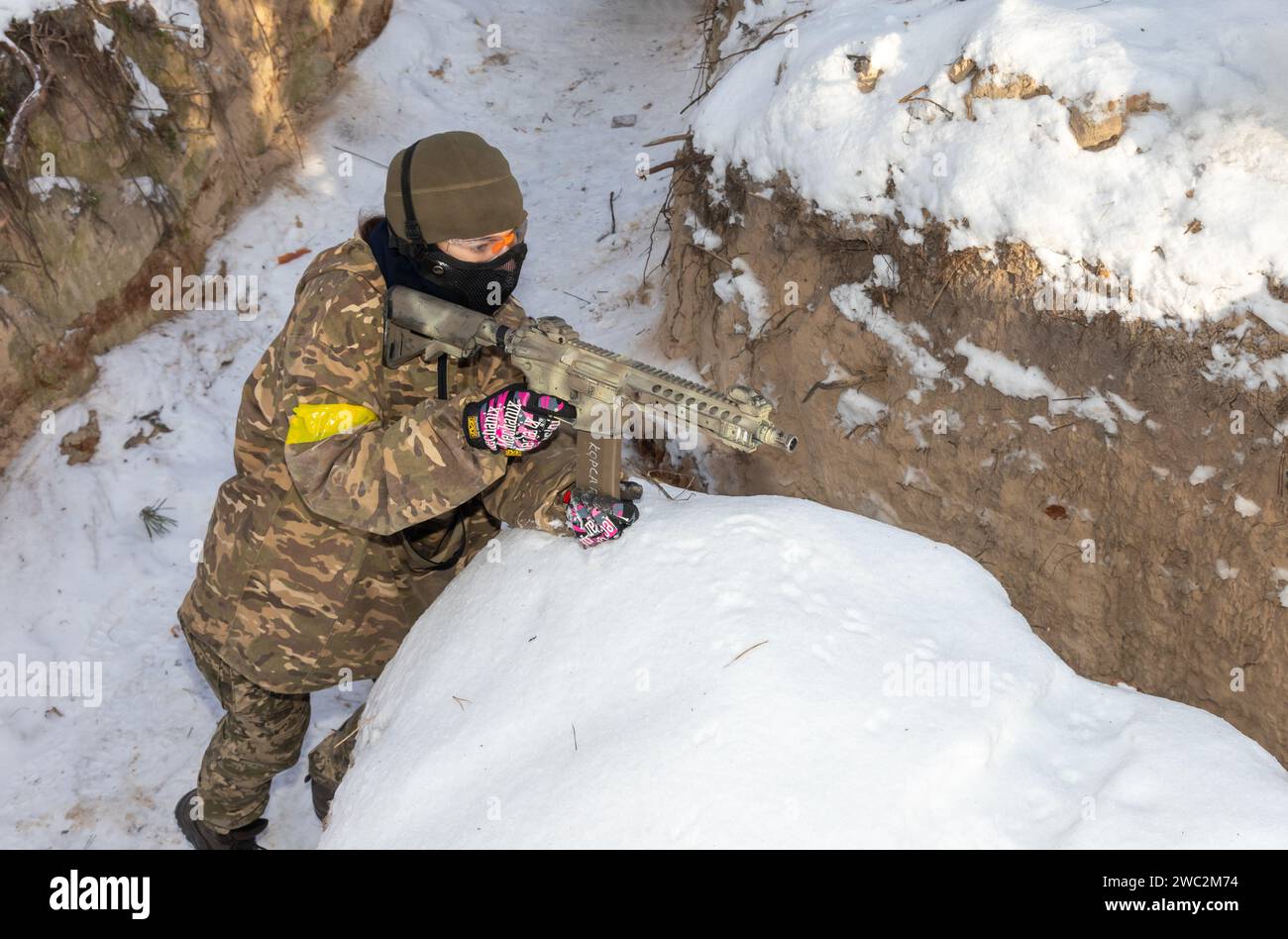 Kyiv, Ukraine. 12th Jan, 2024. A fighter is seen in a trench in a ...