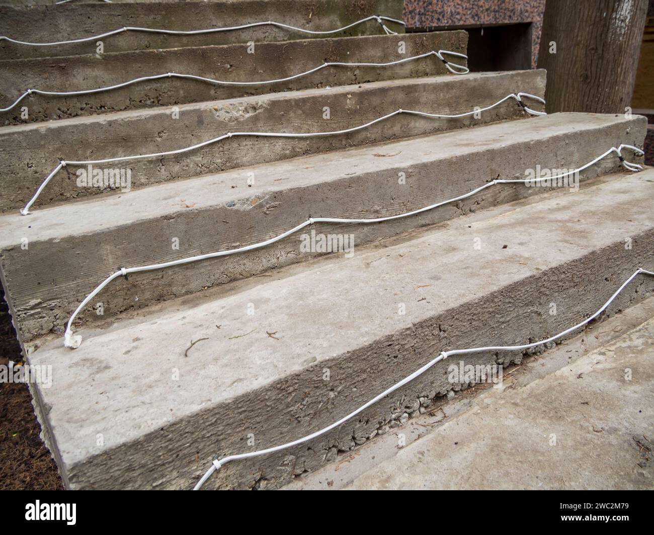 Preparing wiring for installing concrete step lighting Stock Photo - Alamy