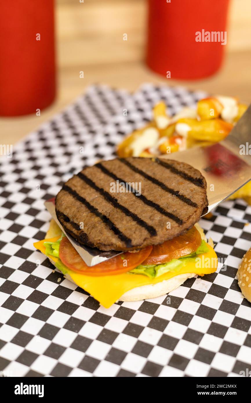 details of hamburger meat with grill marks, on a cheeseburger, fast ...