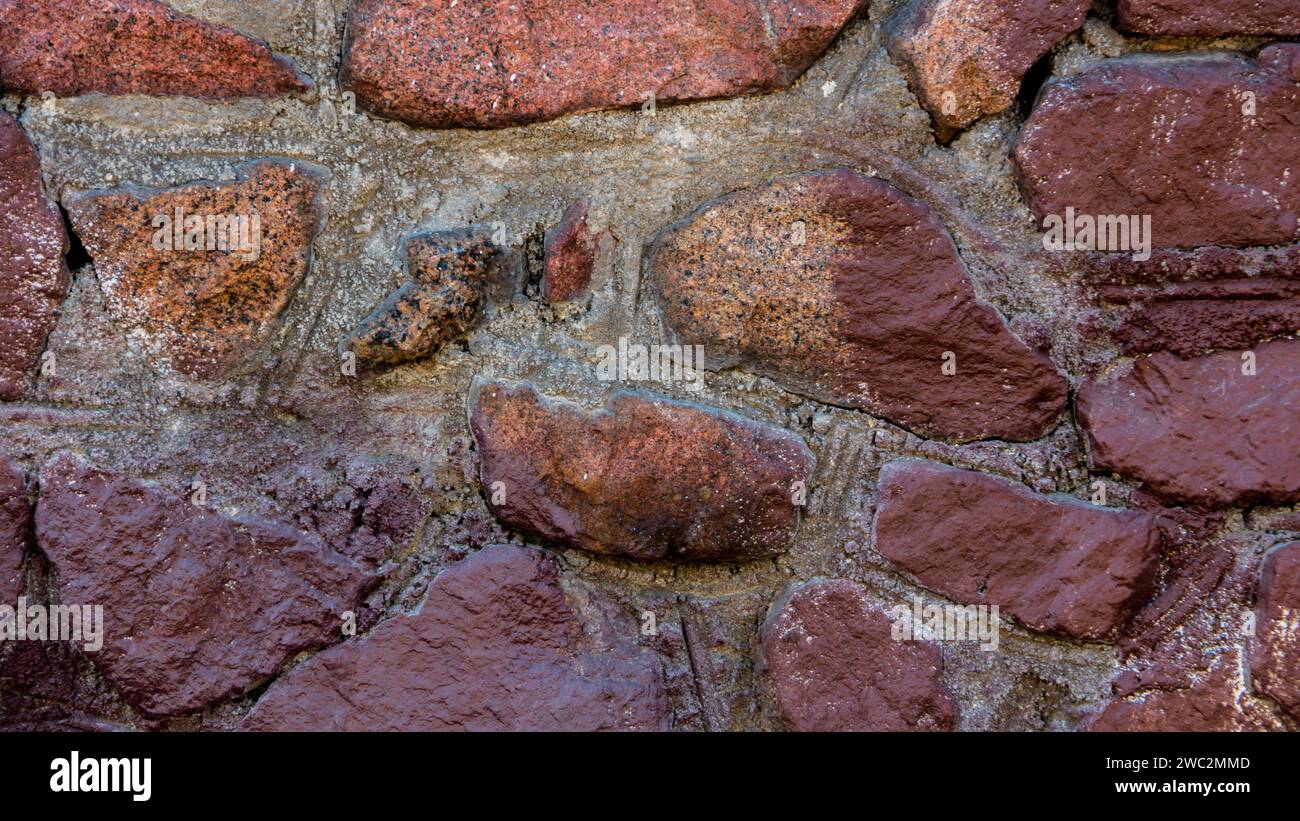 Abstract background of a multi-colored stone wall Stock Photo - Alamy