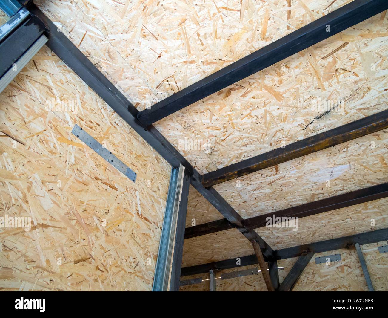 The frame of the profile pipe is sheathed with OSB panels Stock Photo ...