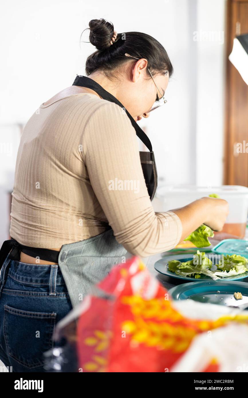 preparing healthy food in restaurant interior, domestic occupation of ...