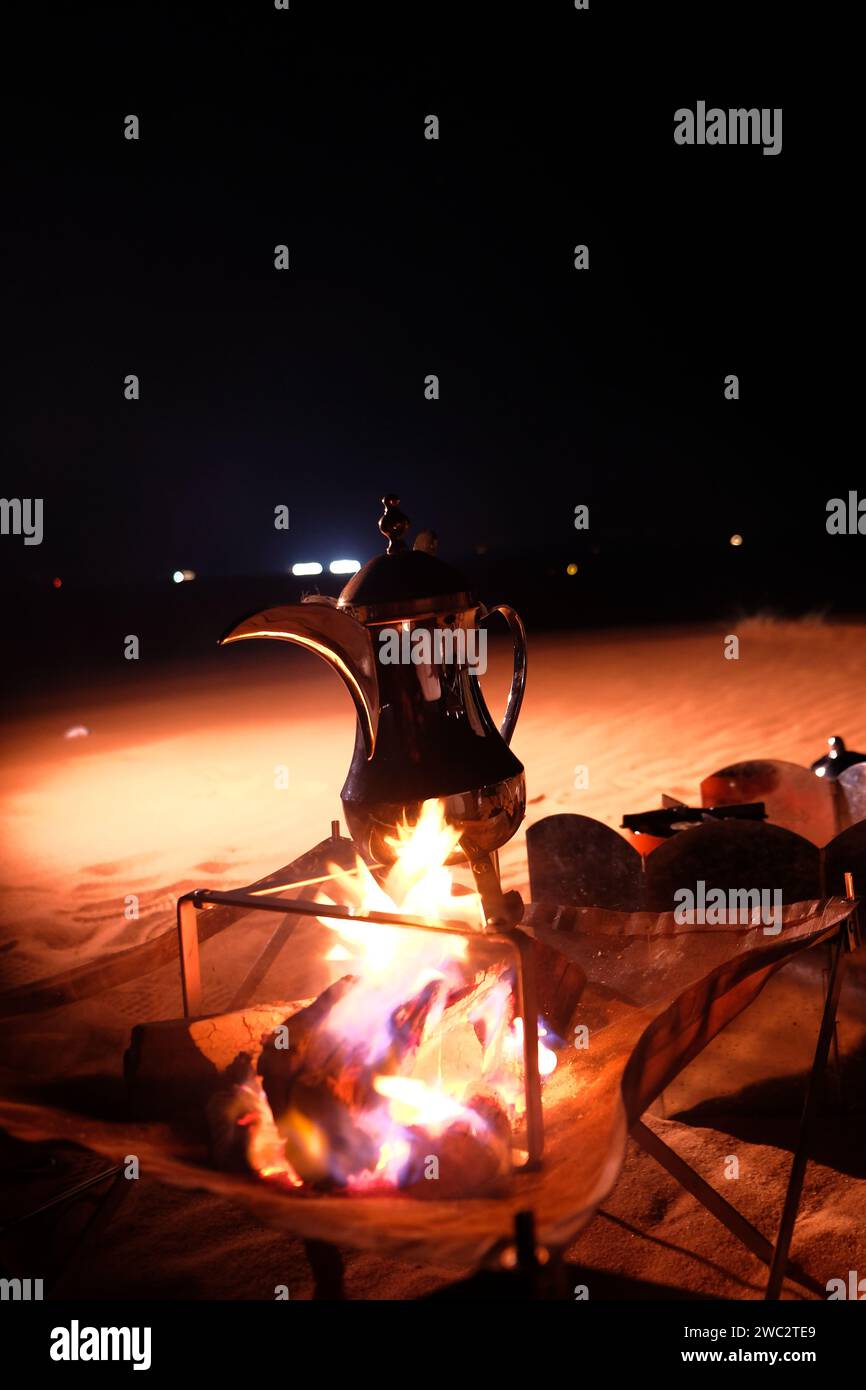 Copper kettle on fire used to cock Saudi and Arabic coffee Stock Photo ...