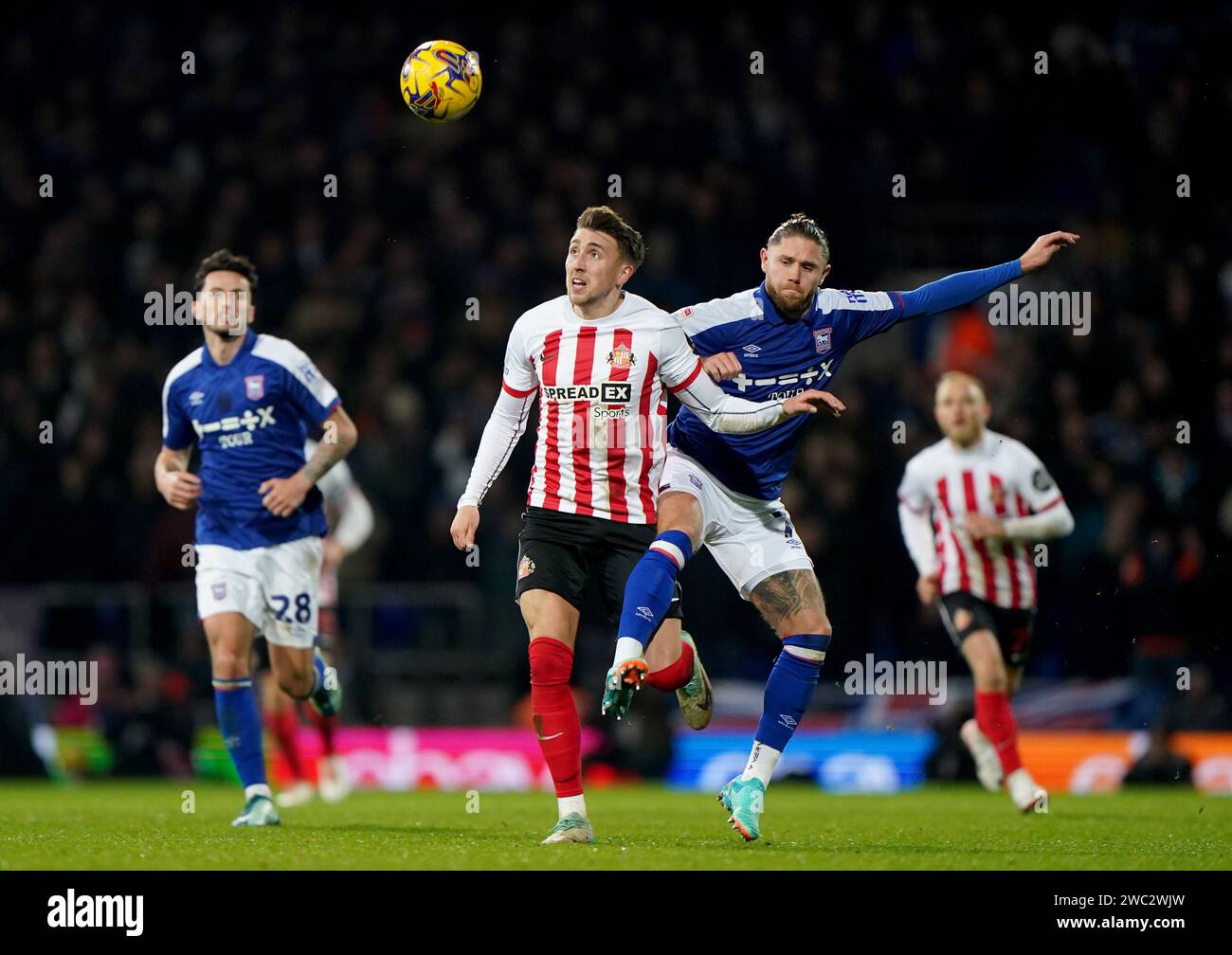 Sunderland's Dan Neil (left) is foulded by Ipswich Town's Wes Burns ...