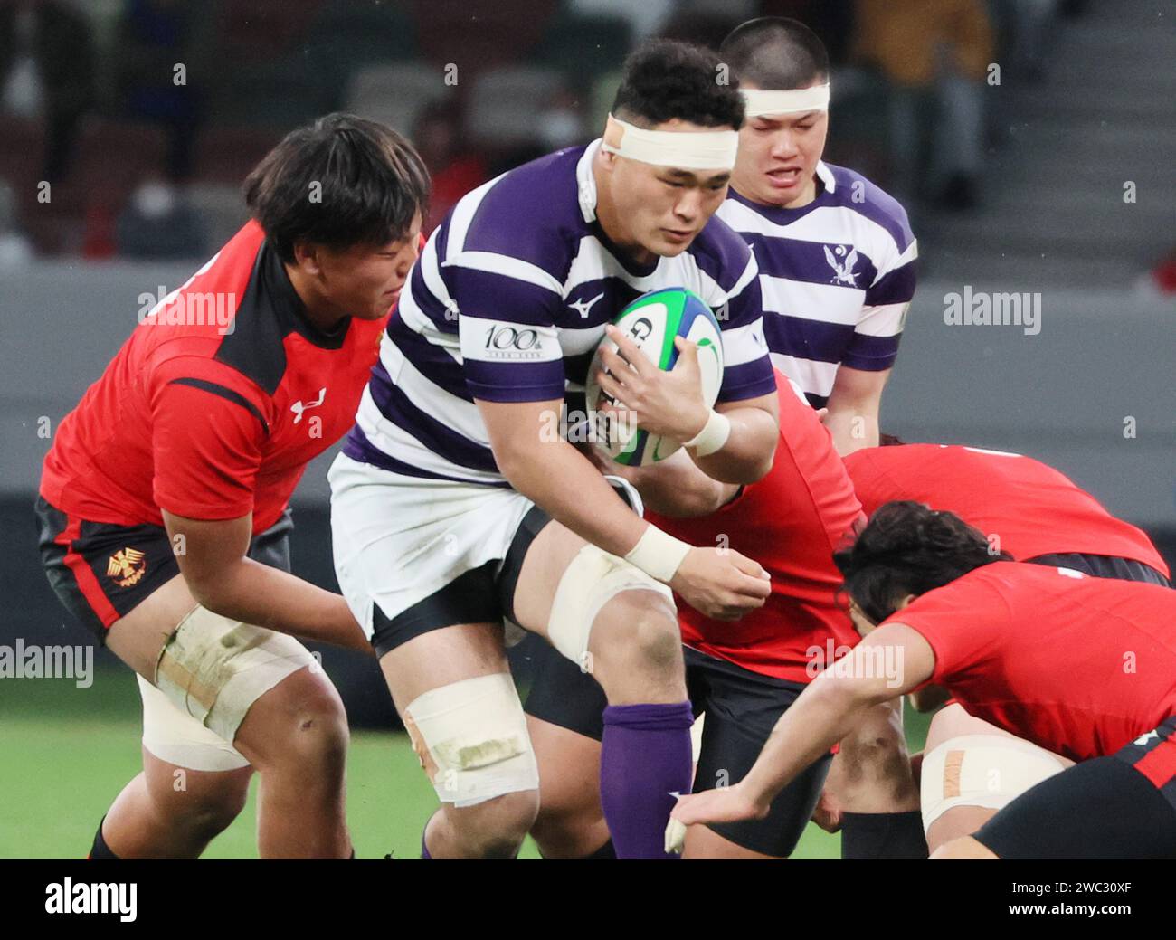 Tokyo, Japan. 13th Jan, 2024. Meiji University No.8 Taishiro Kido carries the ball during the ...