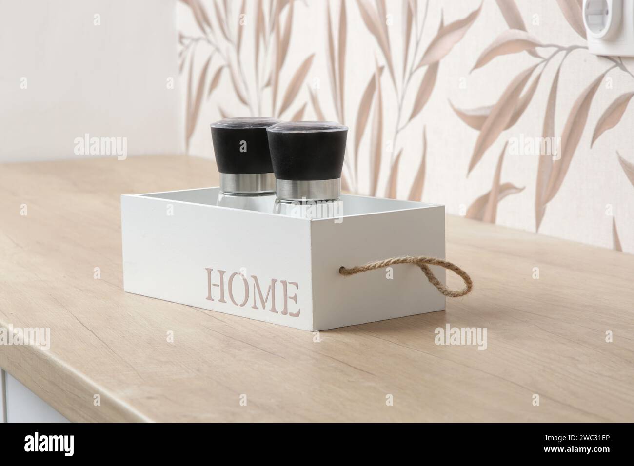 Salt and pepper containers in the wooden box on the kitchen counter ...