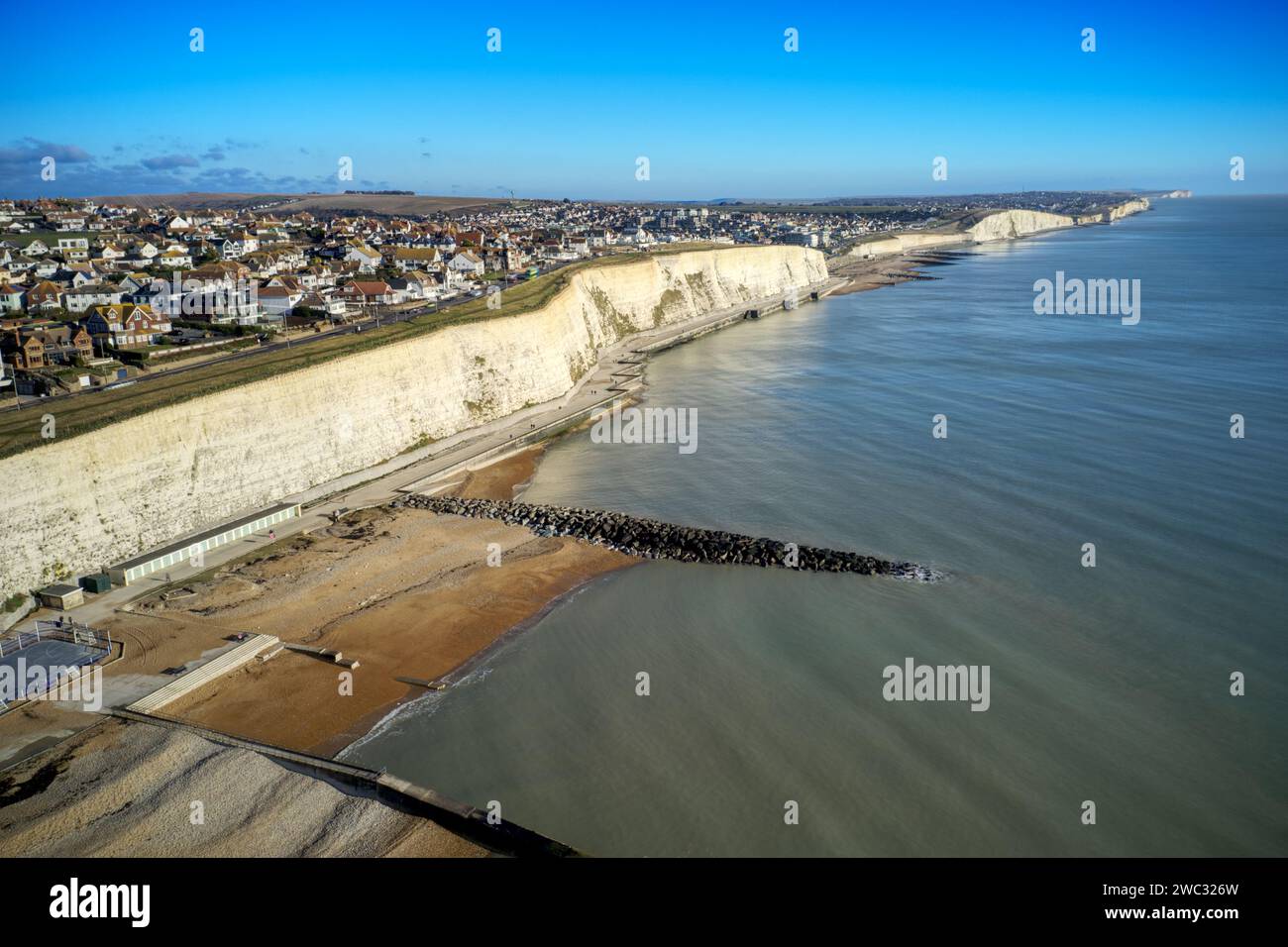 Aerial view of the white chalk cliffs and undercliff walk at ...