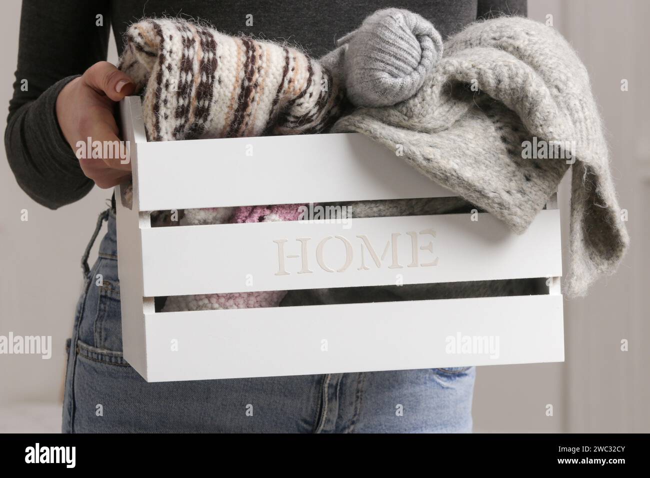 Woman packing box clothes hi-res stock photography and images - Alamy