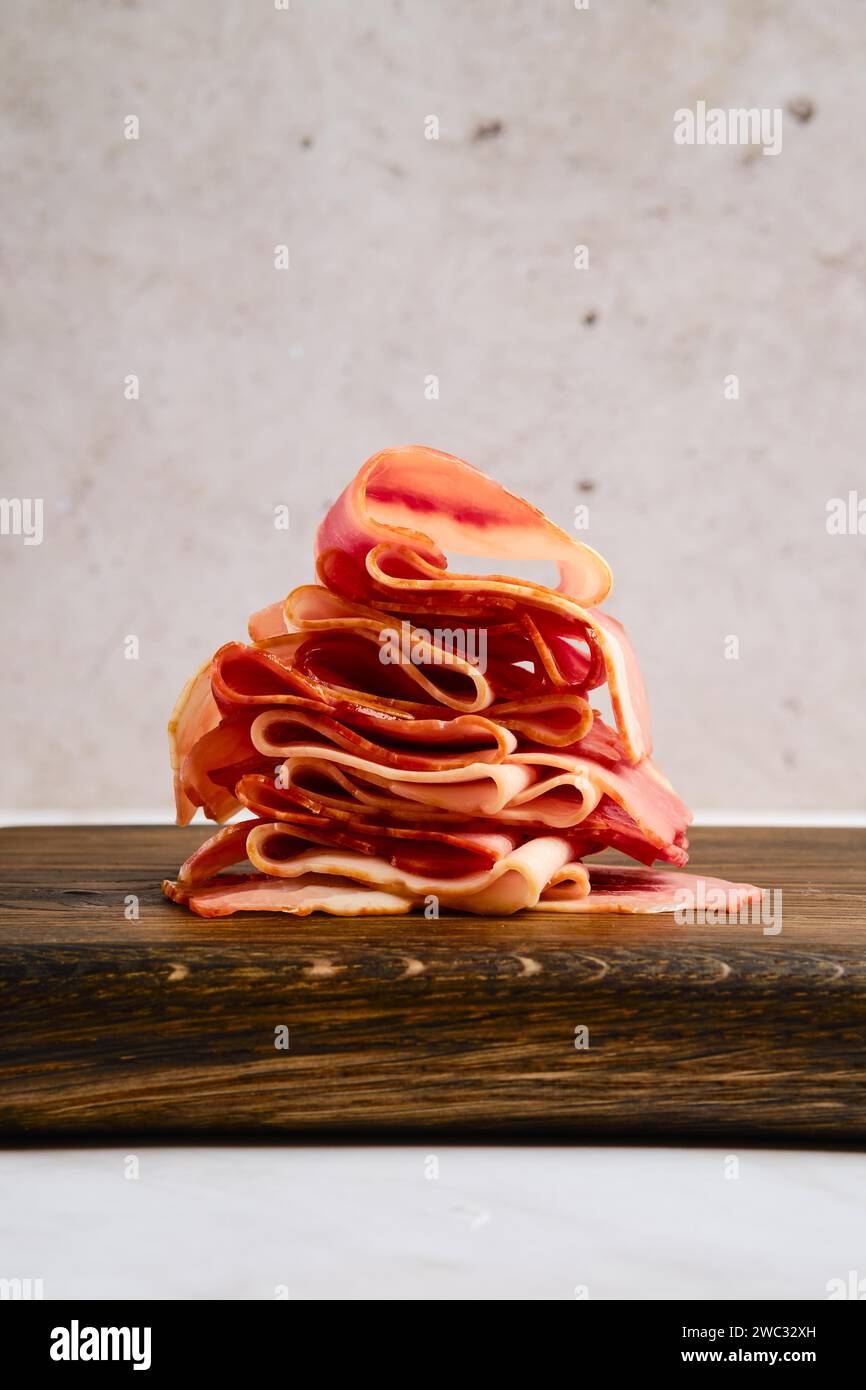 Smoked bacon pieces stacked in a stack Stock Photo - Alamy