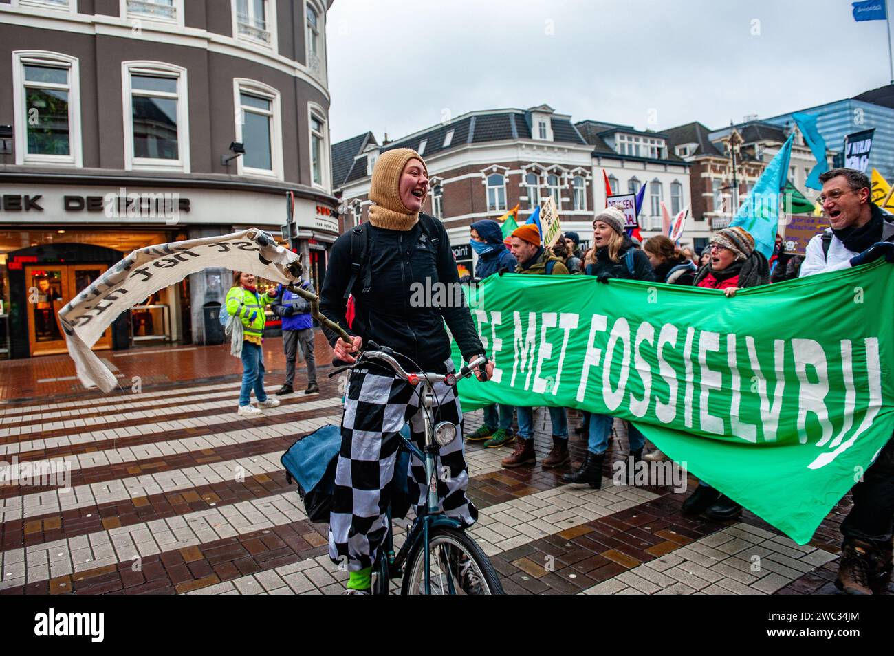 Nijmegen, Netherlands. 13th Jan, 2024. An activist on her bike is seen ...