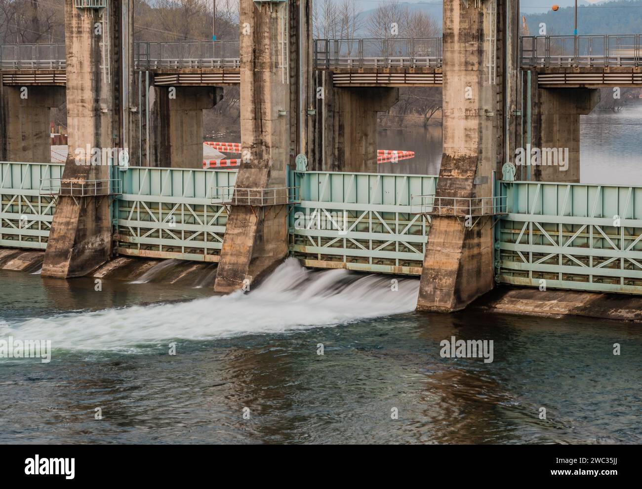 River dam in South Korea with water flowing through one of the flood ...