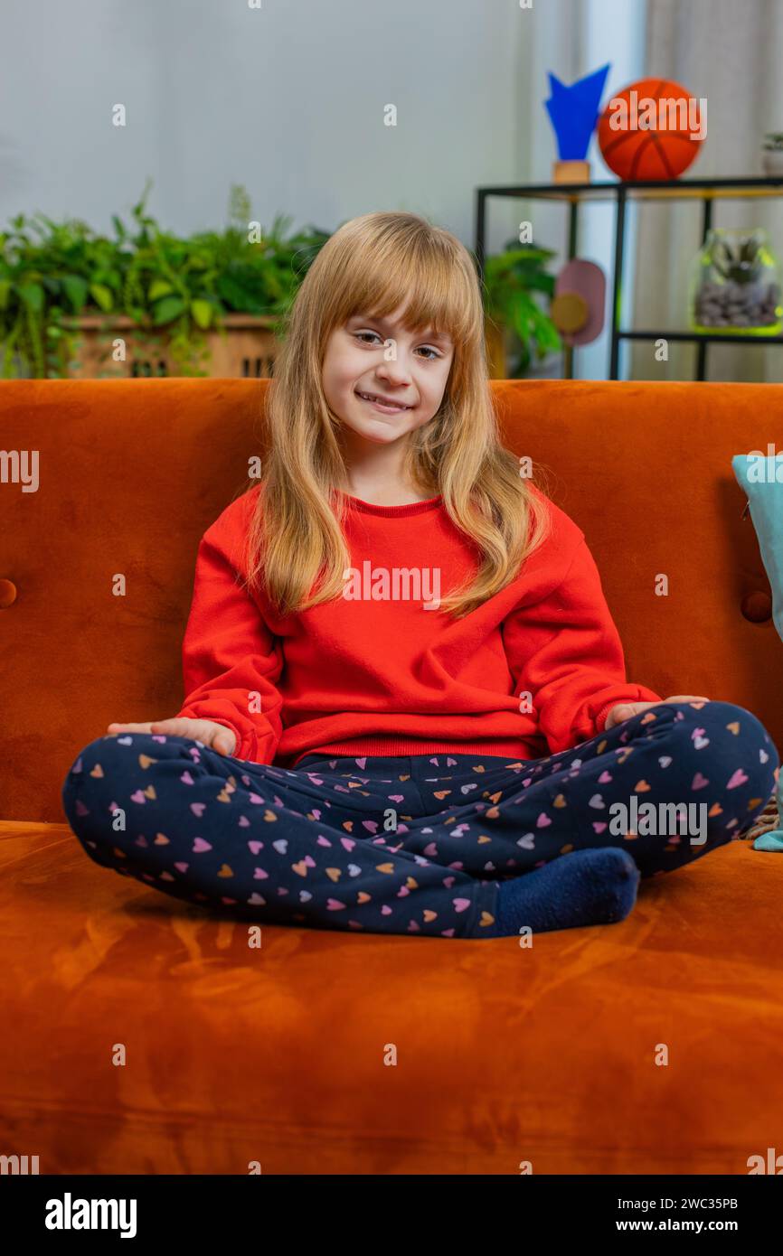 Close-up portrait of happy smiling cheerful Caucasian preteen school girl 8 years old. Young ...