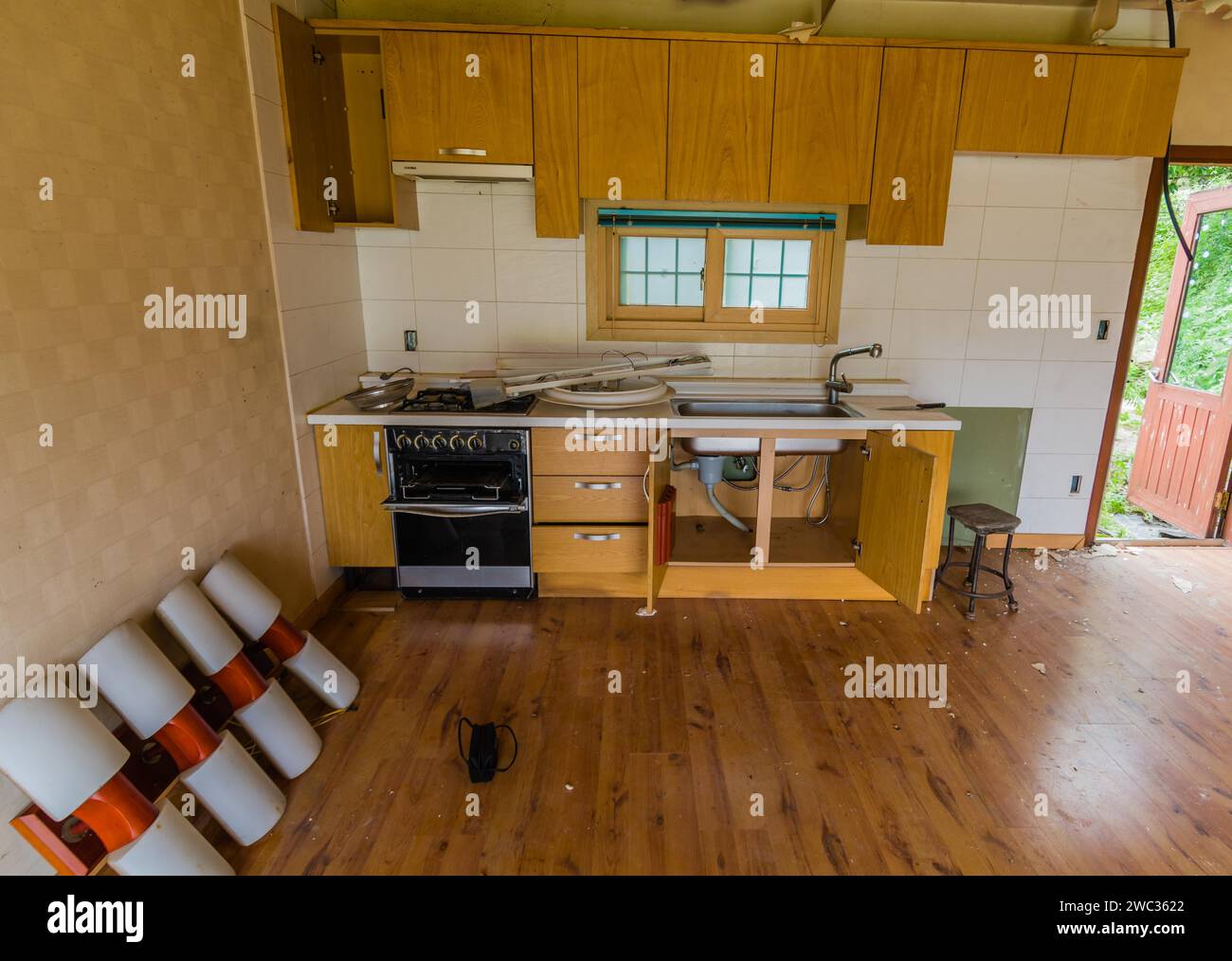 Kitchen area of abandoned house with dirt and electrical fixtures ...