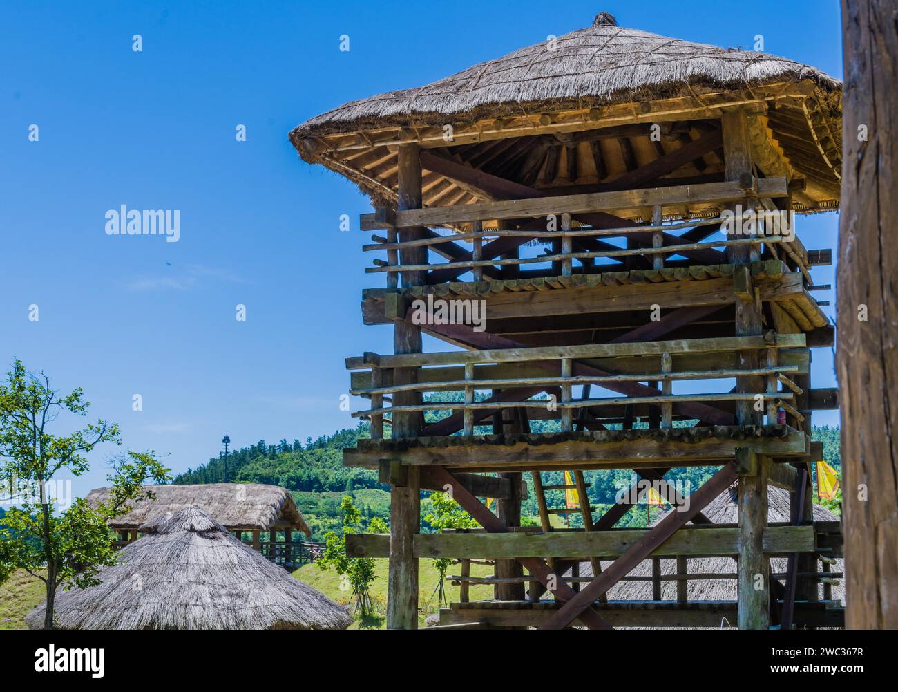 Large wooden guard tower in traditional Korean village in public park ...