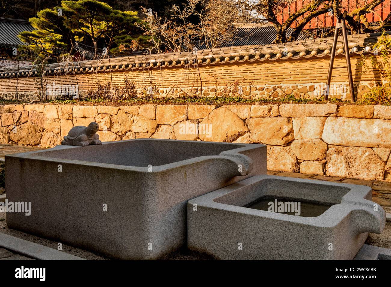 Concrete water cistern with turtle fountain at Buddhist temple Stock ...