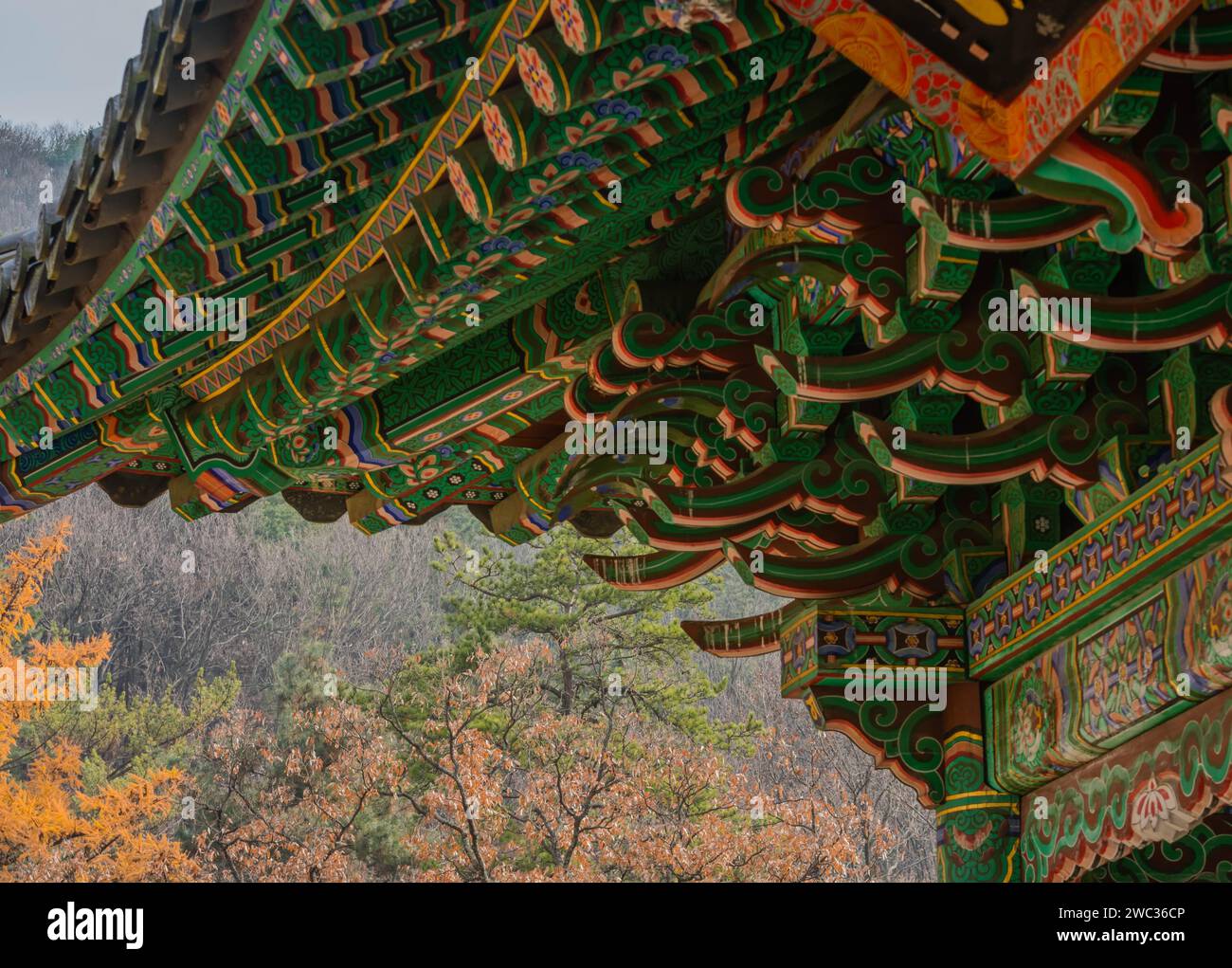 Corner roof of Buddhist temple building with beautiful green, yellow ...