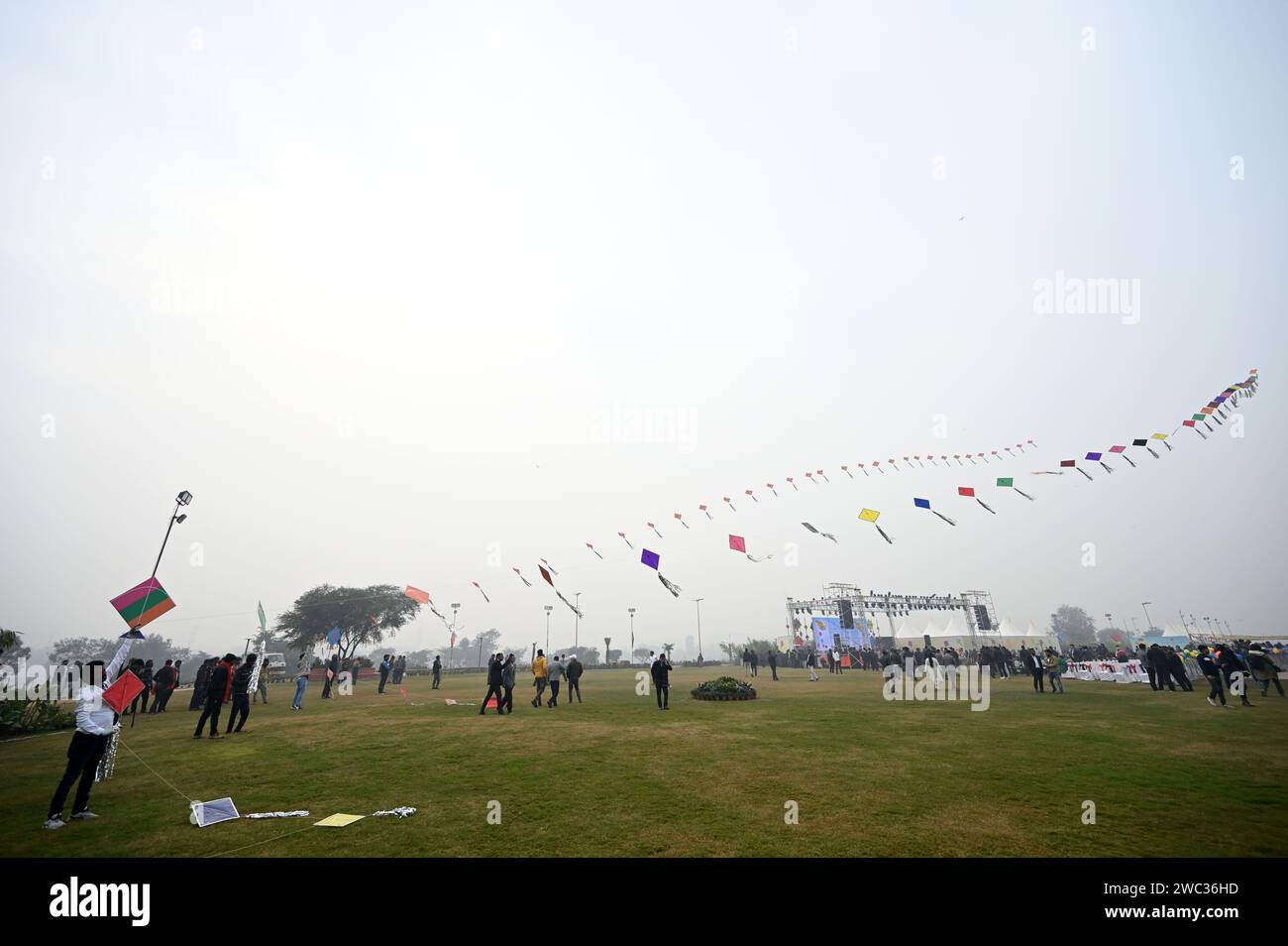 NEW DELHI, INDIA - JANUARY 13: People flying kites during the first ...