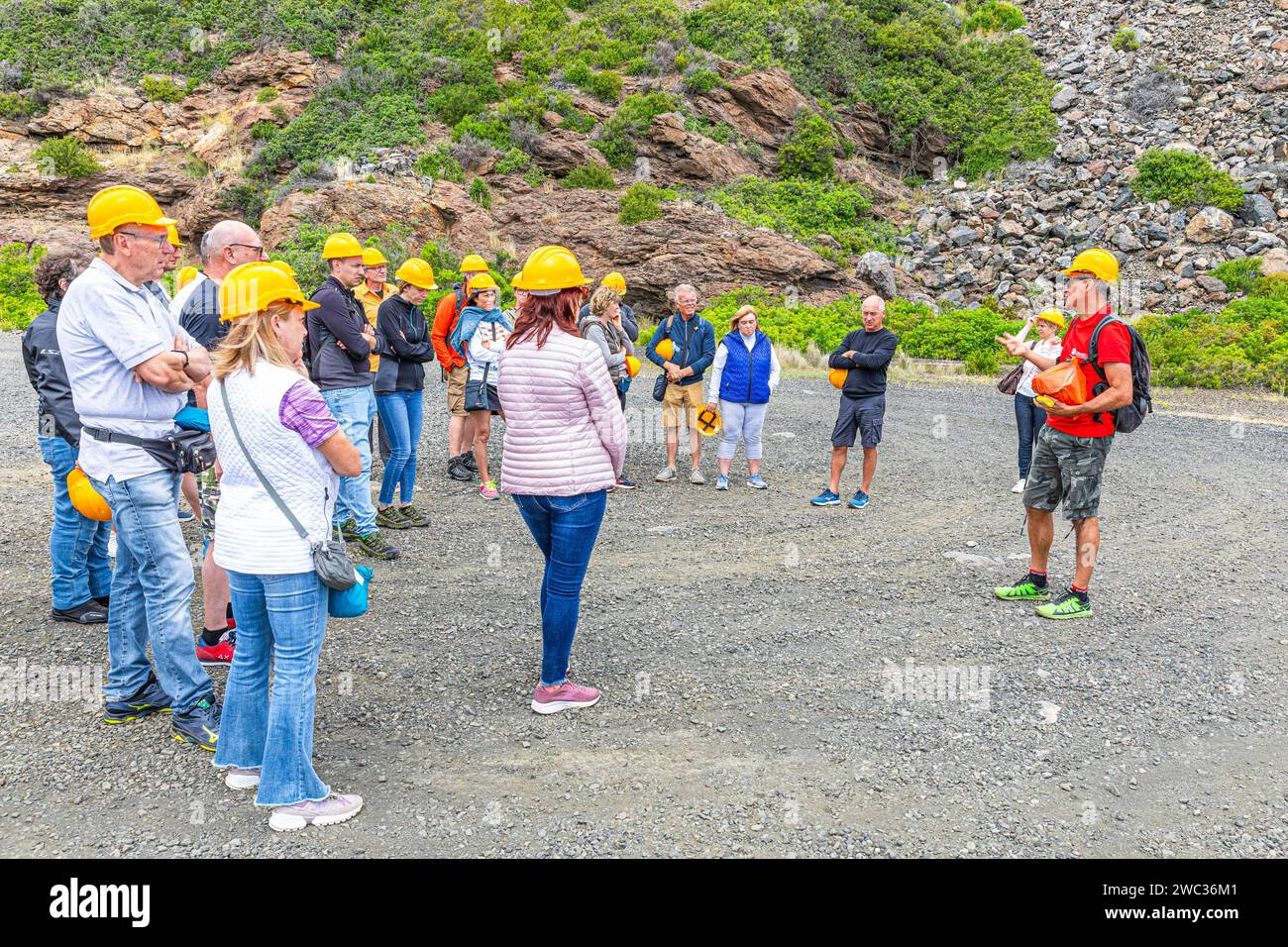 Tourist group on a guided tour of the former Miniere Calamita mine ...