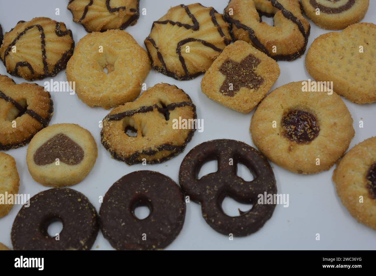 A bright assortment of shortbread cookies covered with chocolate and ...
