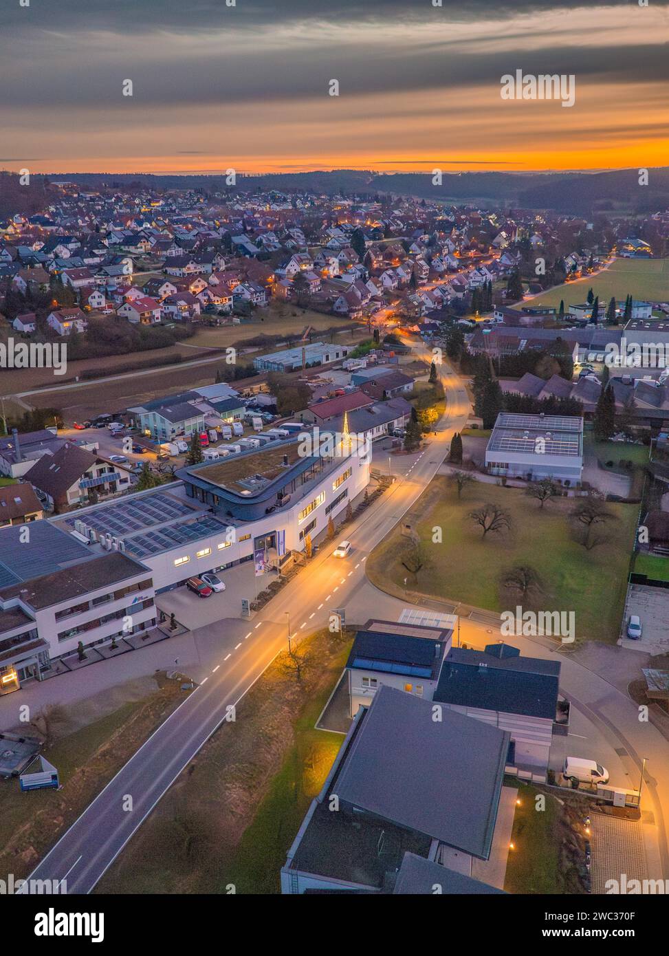 Aerial photo of a town at dusk with illuminated sky, Christmas tree on ...
