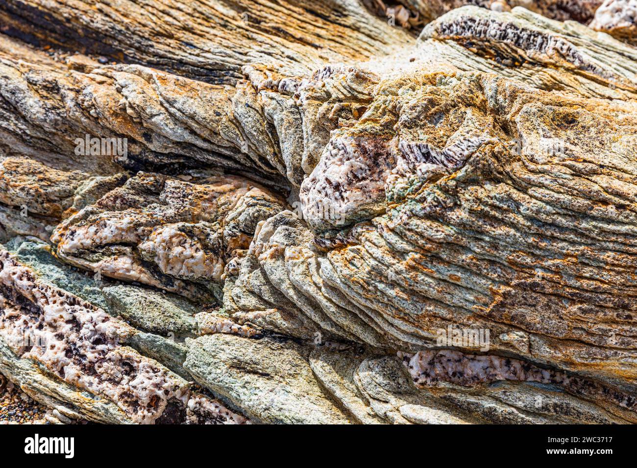 Coloured, ferruginous mineral sandstone on Topinetti beach, near Rio ...