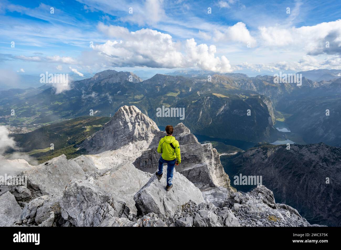 Mountaineer on the rocky summit of the Watzmann Mittelspitze, Watzmann ...