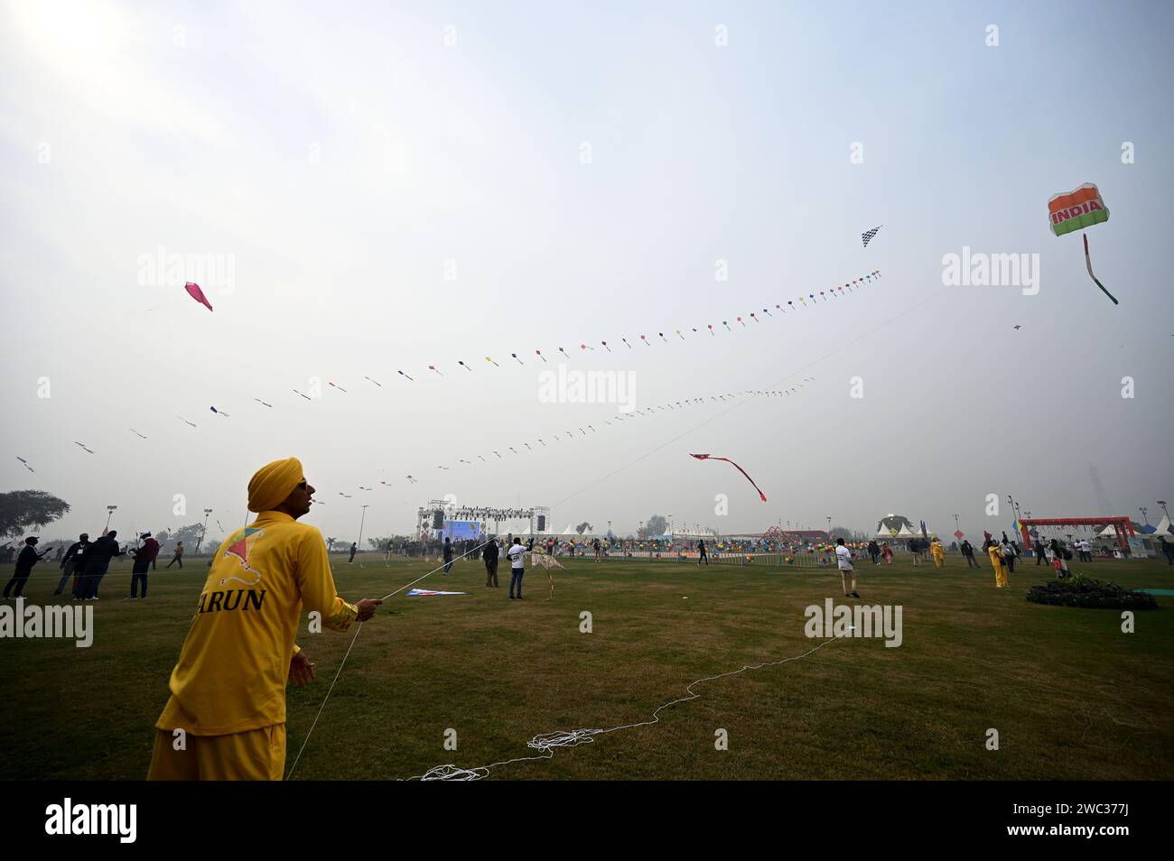NEW DELHI, INDIA - JANUARY 13: People flying kites during the first ...